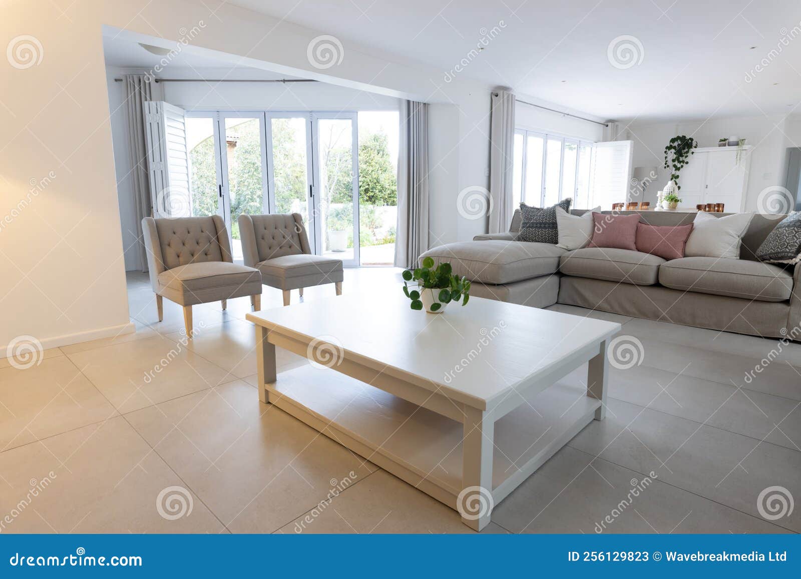 The Interior of a Beautiful Large Modern Living Room with Large Windows ...