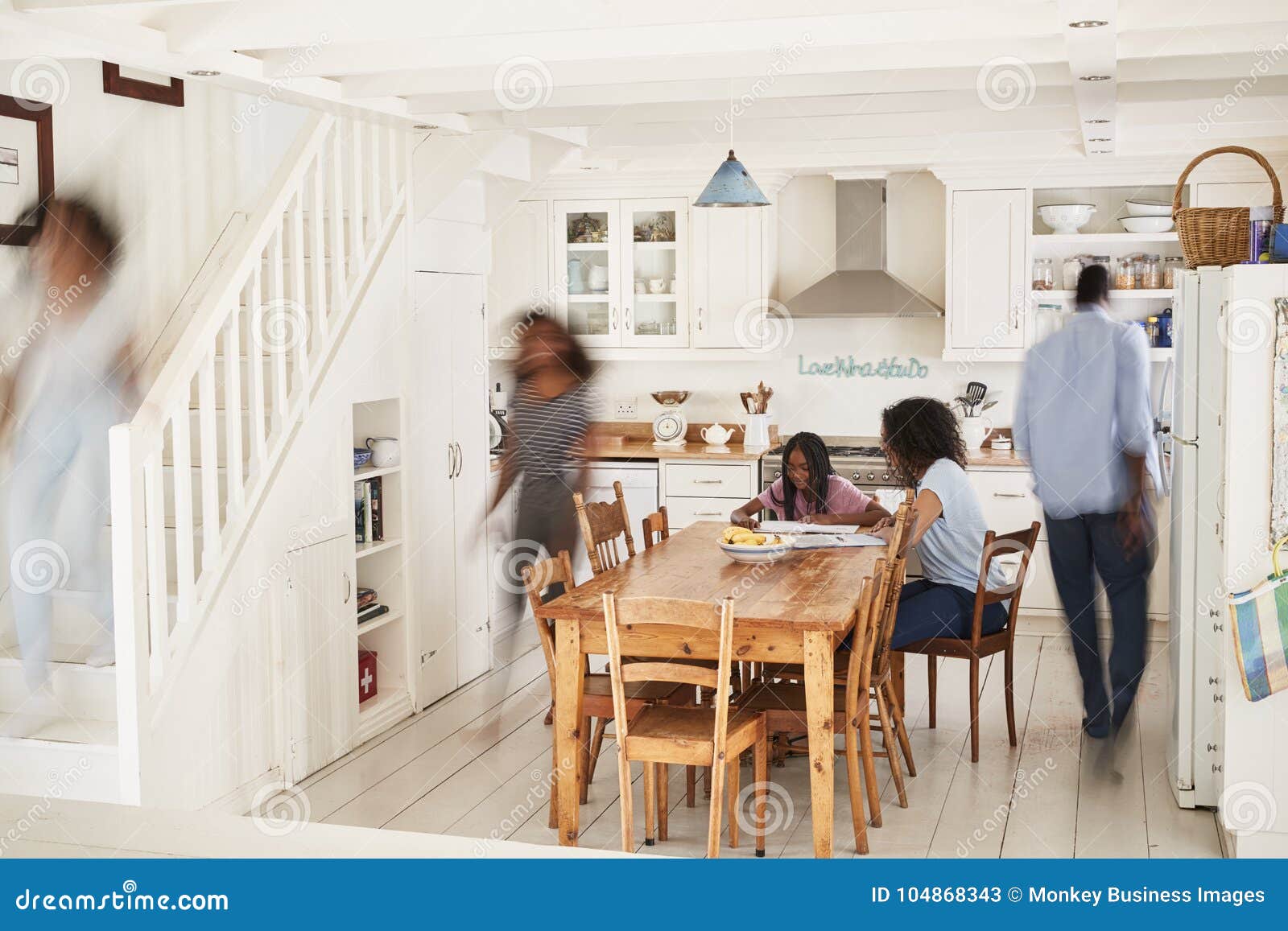 Interior of Busy Family Home with Blurred Figures Stock Image - Image ...