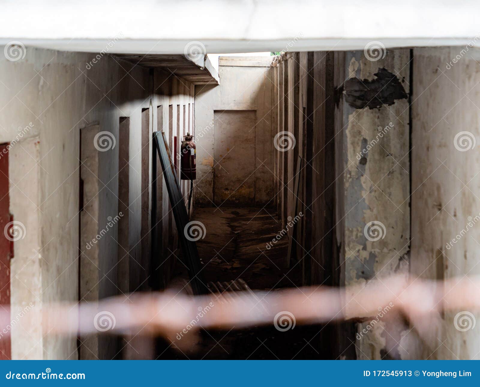 Interior Corridor of a Run-down Abandoned Building Viewed through a ...