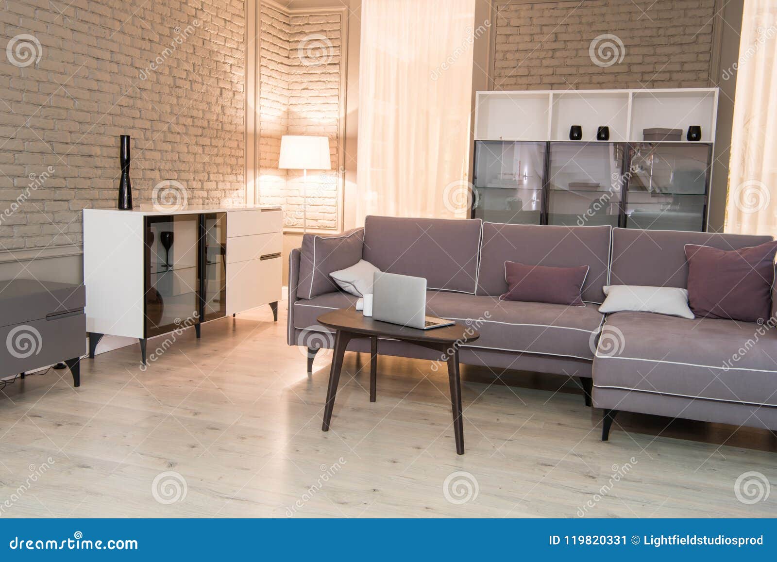 Interior of Cozy Living Room with Couch and Laptop on Table Stock Image ...