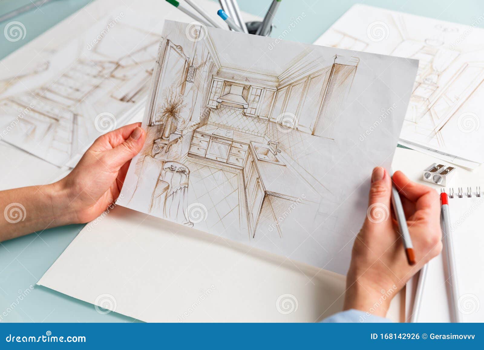 Interior Designer Holding Pencil Sketch Of A Kitchen In A Process Of ...