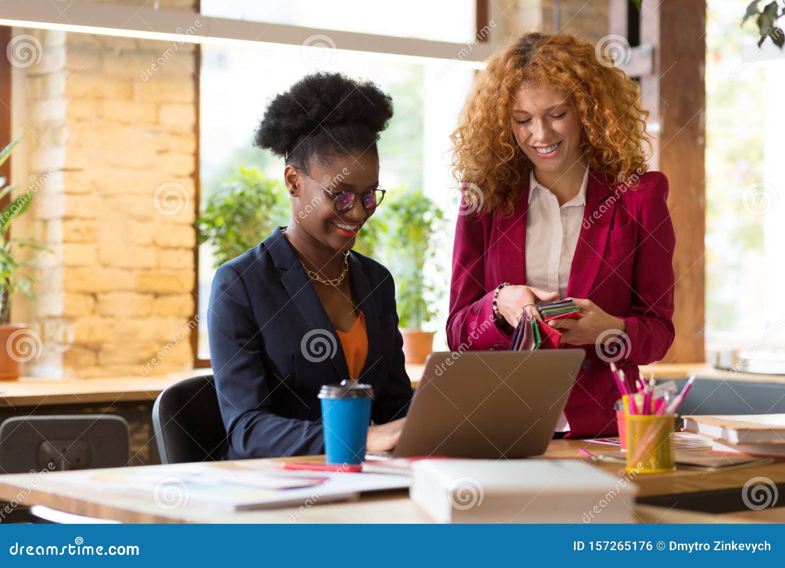 Interior Designer Smiling while Working Together on One Project Stock ...