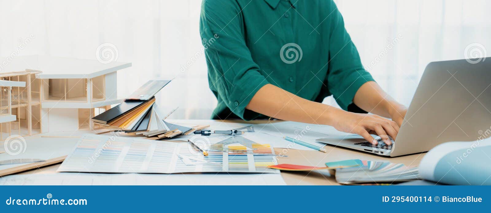 Interior Designer Using Laptop To Create a House Plan. Closeup ...