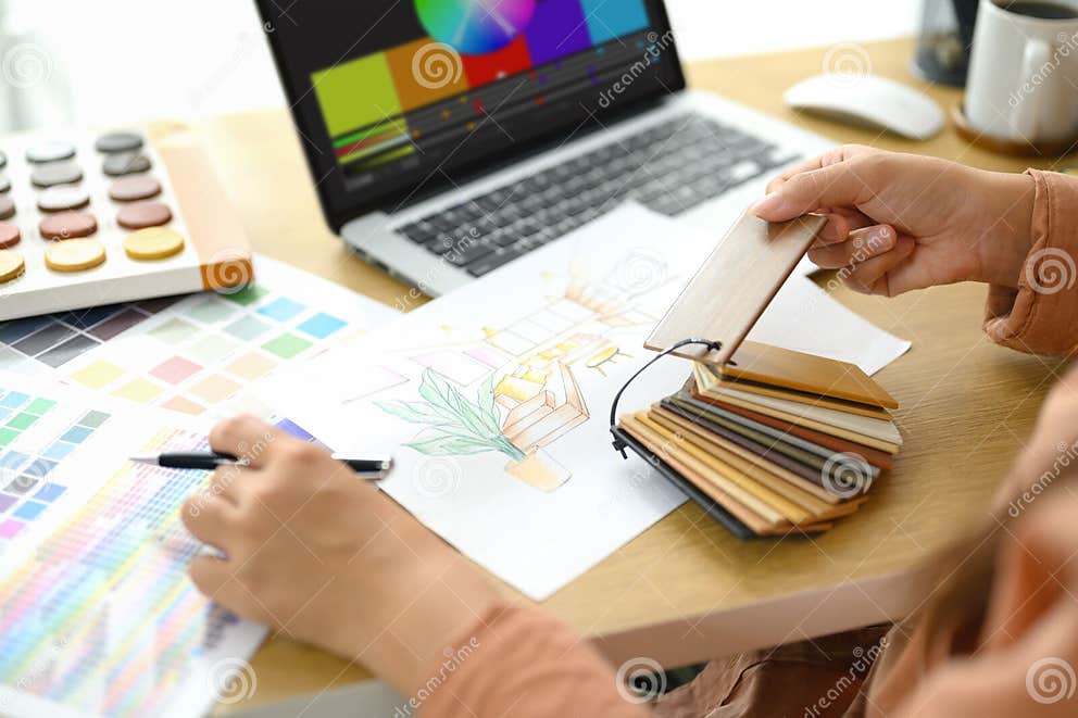 An Interior Designer Working on a Project, Selecting Color and Wood ...