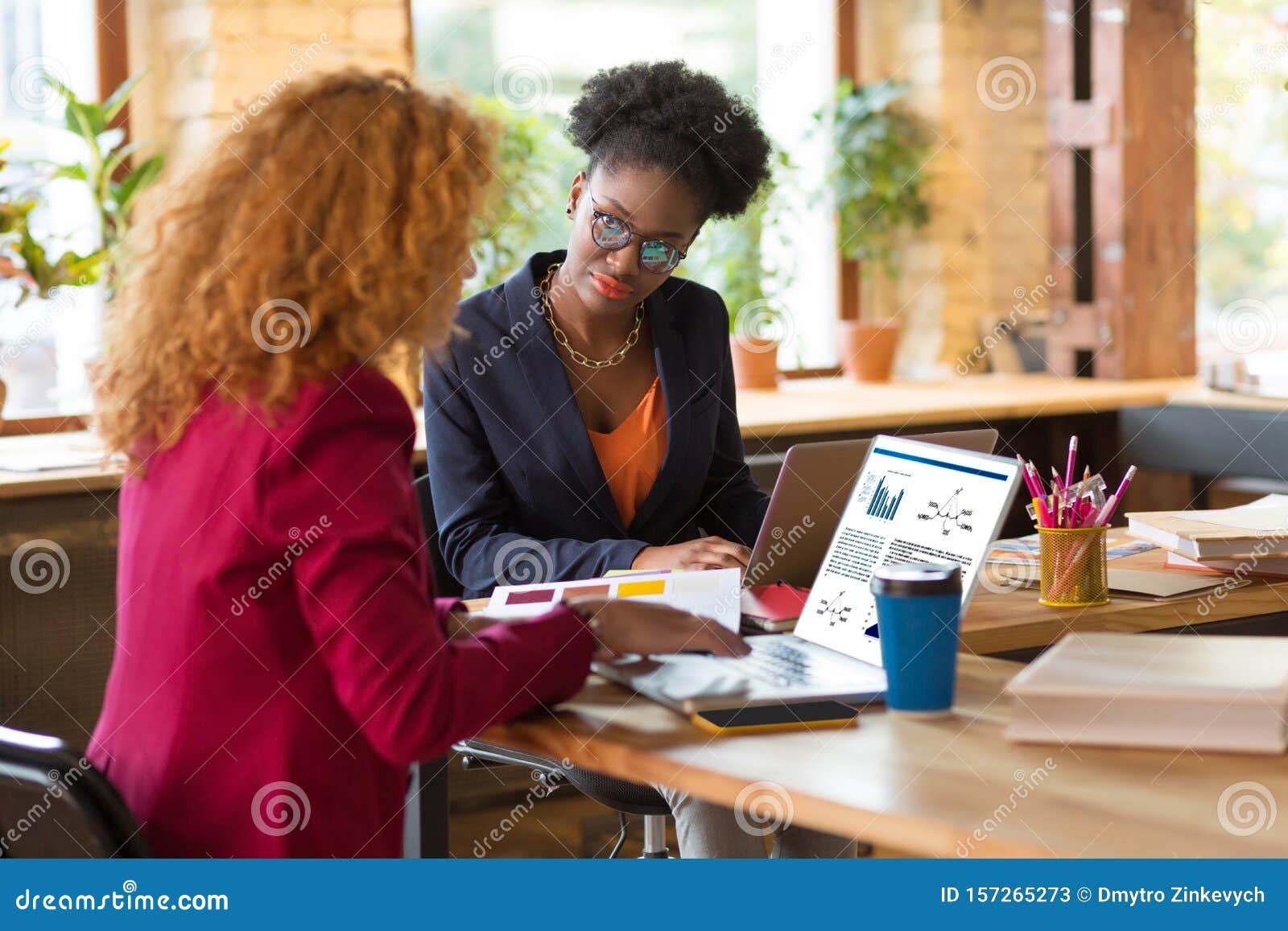 Interior Designers Using Their Laptops while Contacting Clients Stock ...