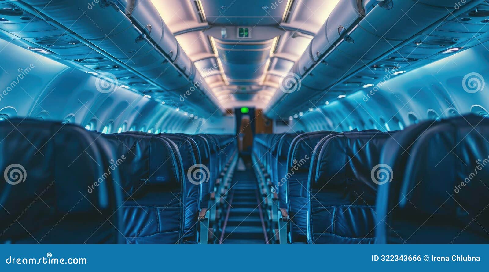 The Interior of an Empty Airplane Cabin, Featuring Rows of Seats Under ...