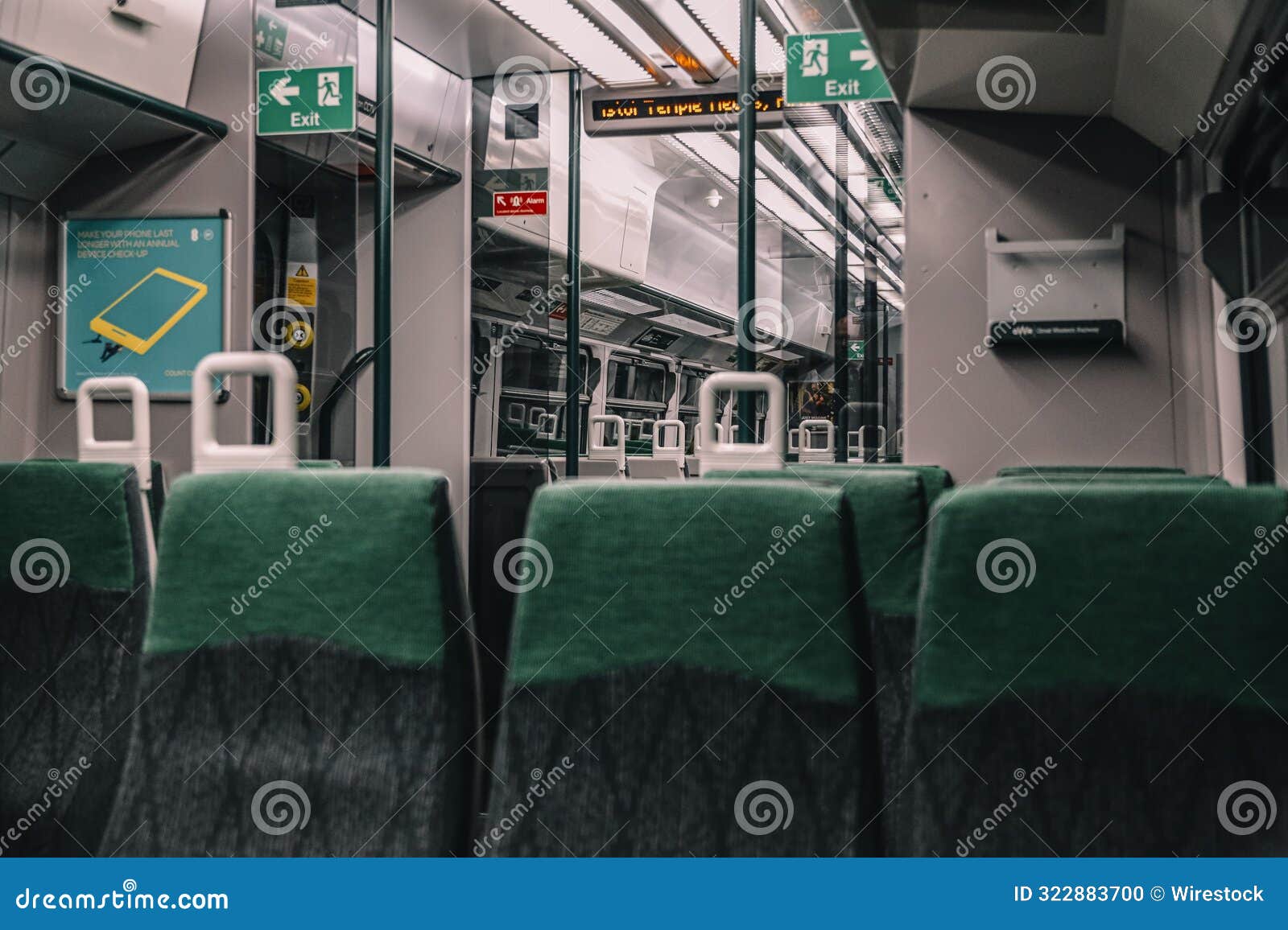 Interior of an Empty Modern Train with Green Seats and Exit Signs ...