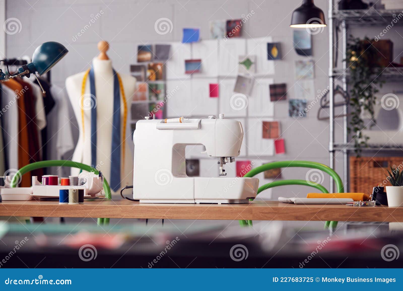 Interior of Fashion Design Studio with Sewing Machine and Mannequin ...