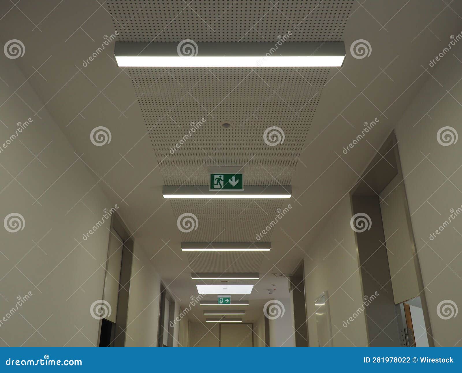 Interior Hallway with a Sign Pointing To the Exit. Stock Photo - Image ...