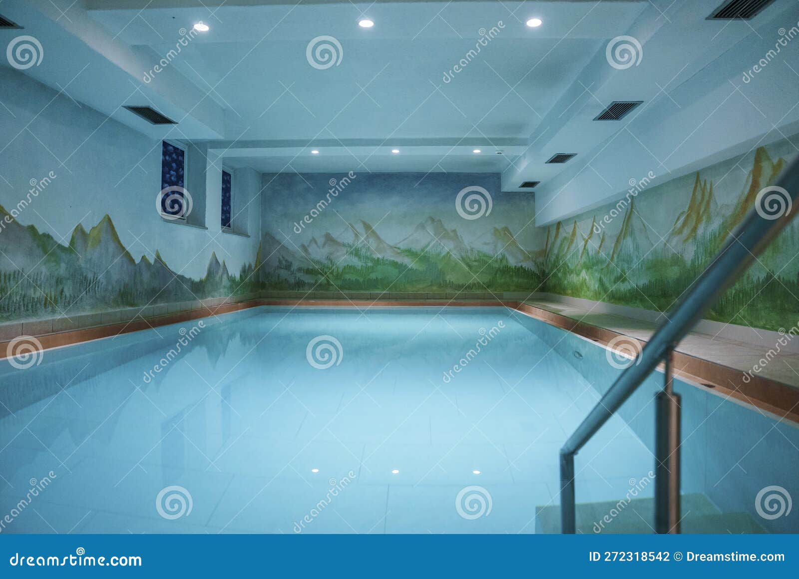 Illuminated Empty Swimming Pool in Front of Wall in Hotel Stock Photo ...