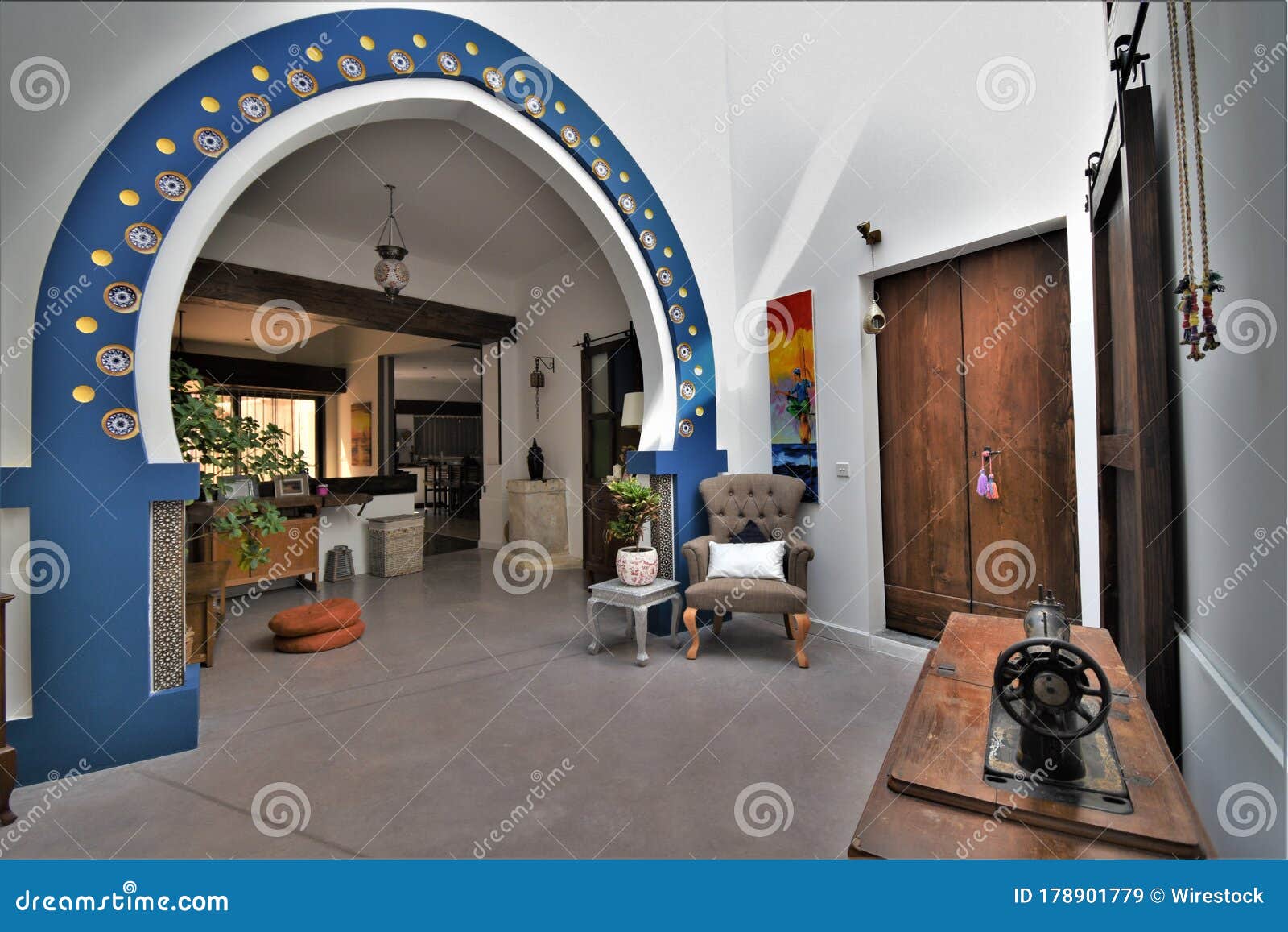 Interior of a House with a Blue Arch Decorated with Circles and Plants ...