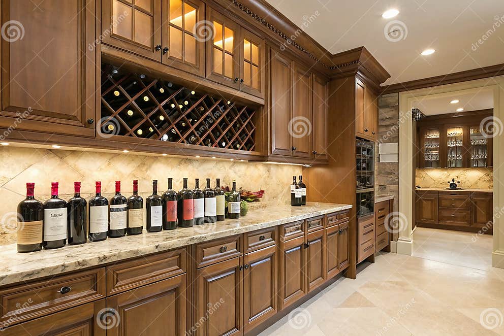 Interior of Kitchen with Wine. Kitchen with Rows of Wine Bottles in ...