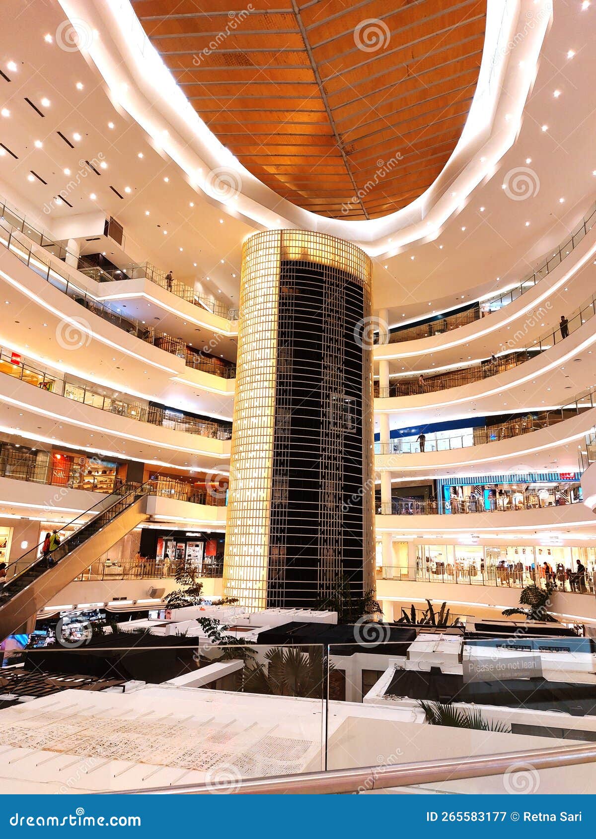 The Interior of a Mall with Elevator Column Seemingly Reaches Out the ...