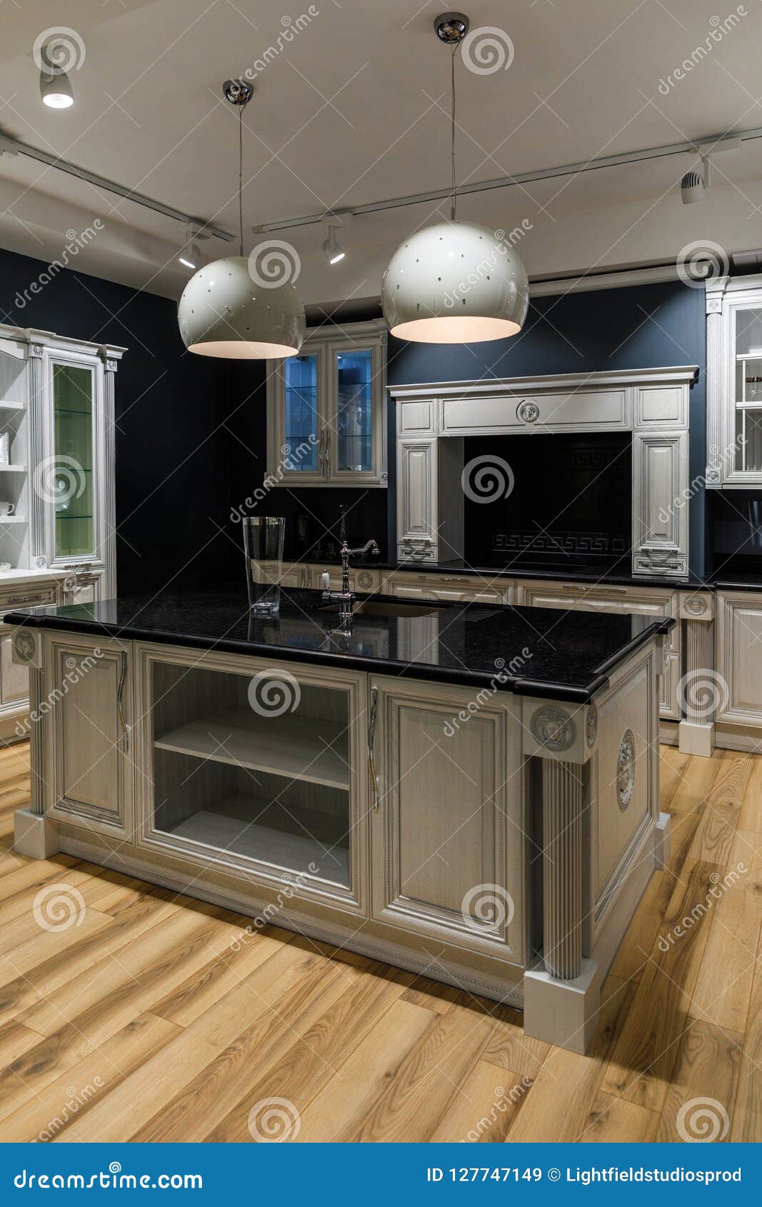 Interior of Modern Kitchen with Lamps Over Counter Stock Image - Image ...