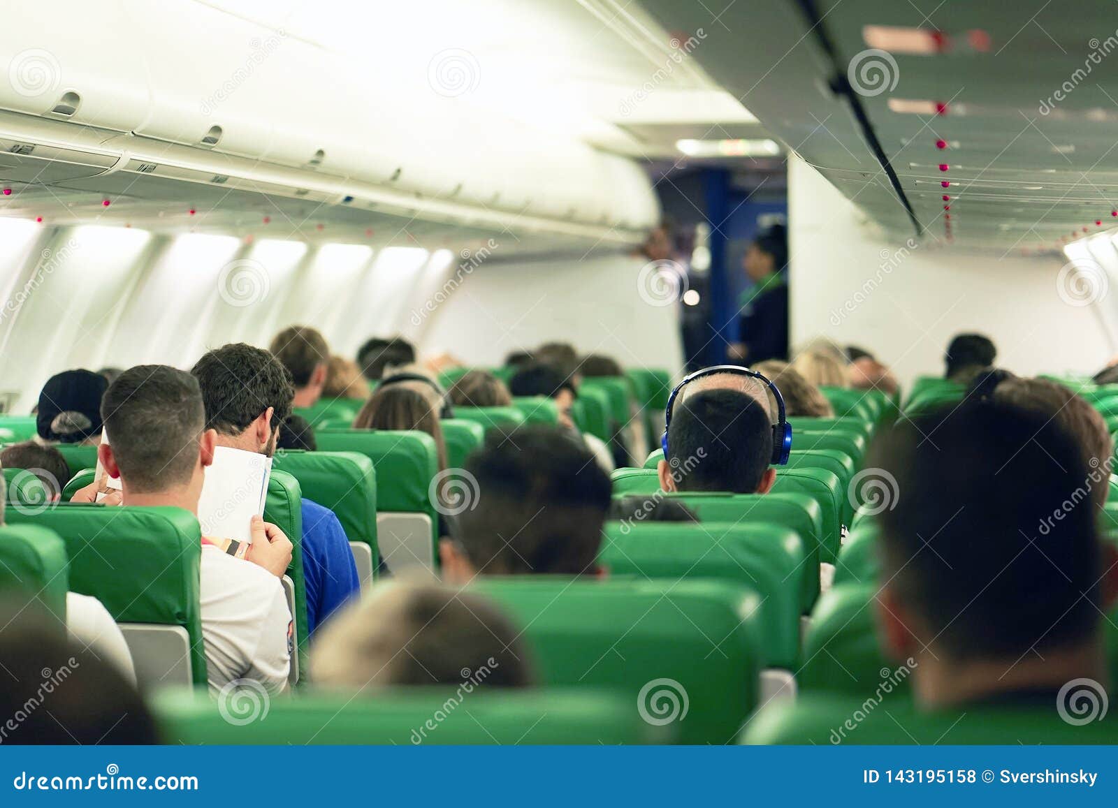 Stewardess in the airplane editorial stock photo. Image of interior ...