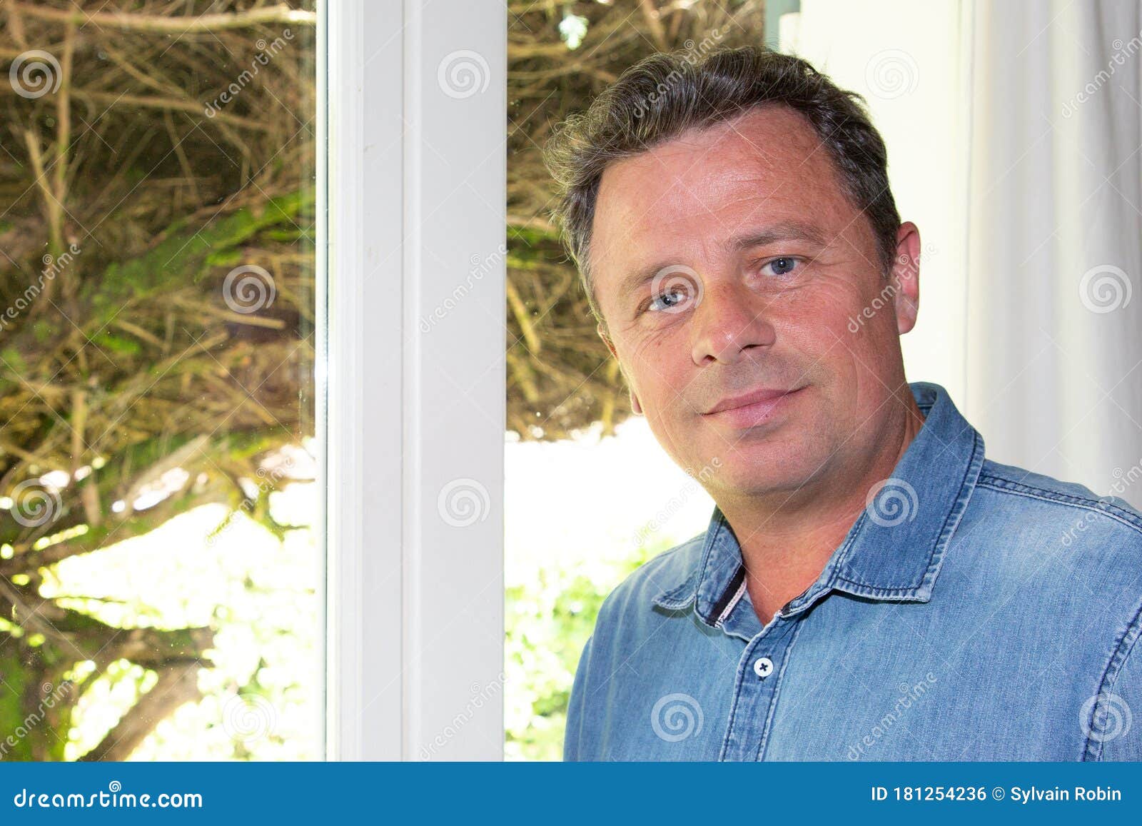 Interior Portrait of Confident Middle Aged Forties Man at Home Windows ...
