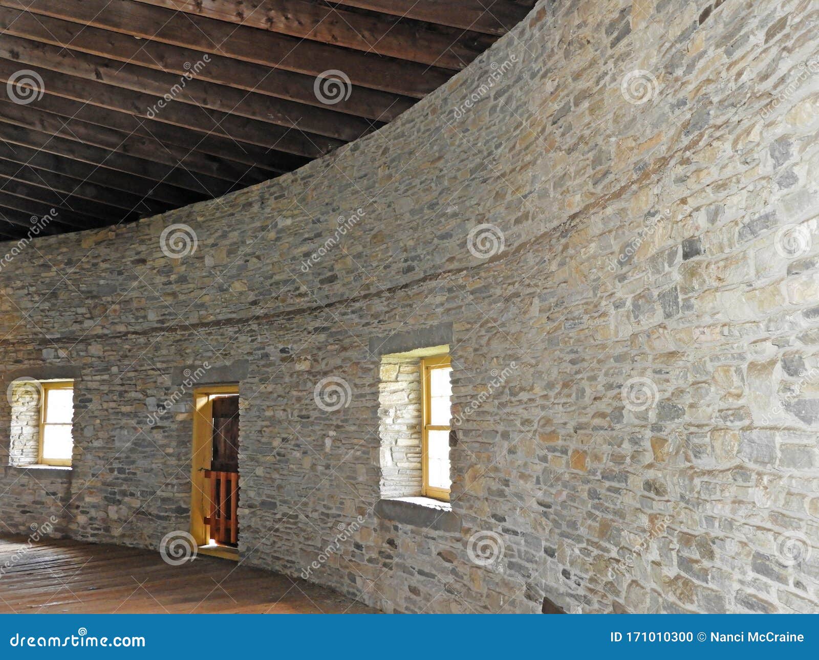 Massive Stone Wall Interior in Shaker Round Stone Barn Stock Photo ...