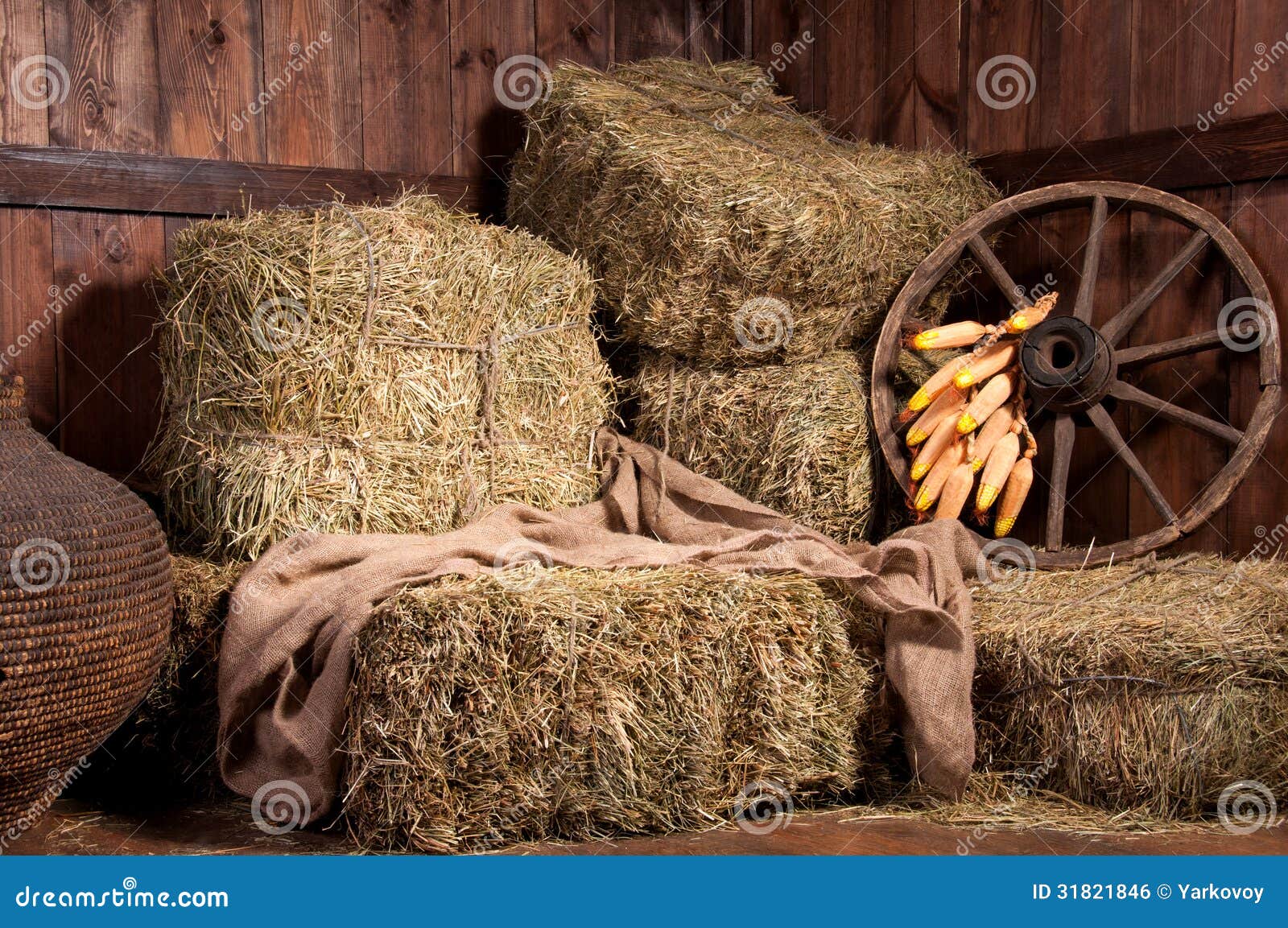 Interior of a Rural Farm - Hay, Wheel, Corn. Stock Photo - Image of ...