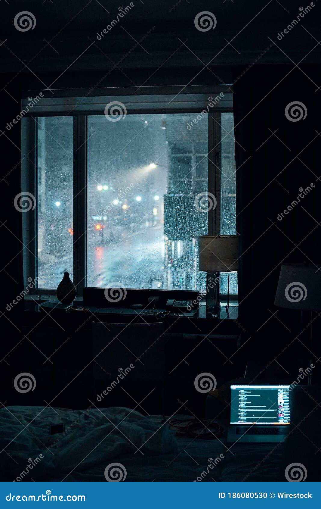 Interior Shot of a Dark Room with the Laptop Computer Left Turned-on on ...