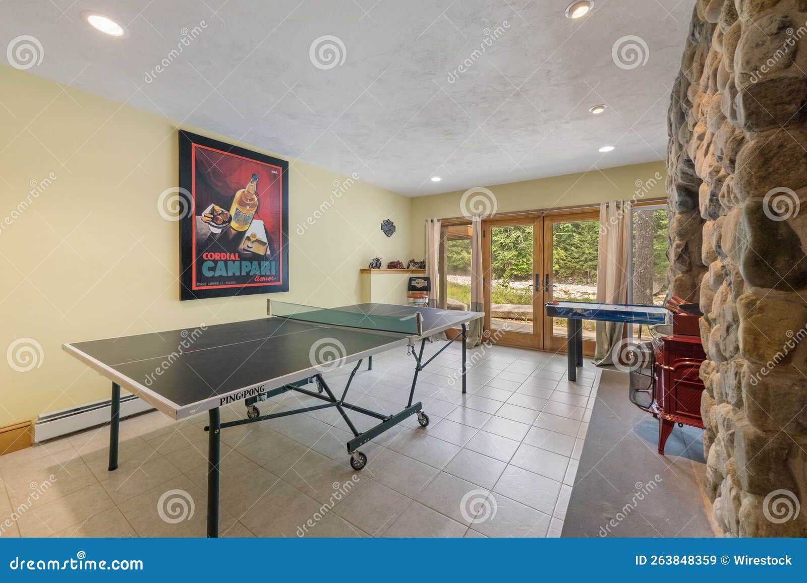 Interior Shot of a Room with a Ping Pong Table, Light Yellow Walls and ...