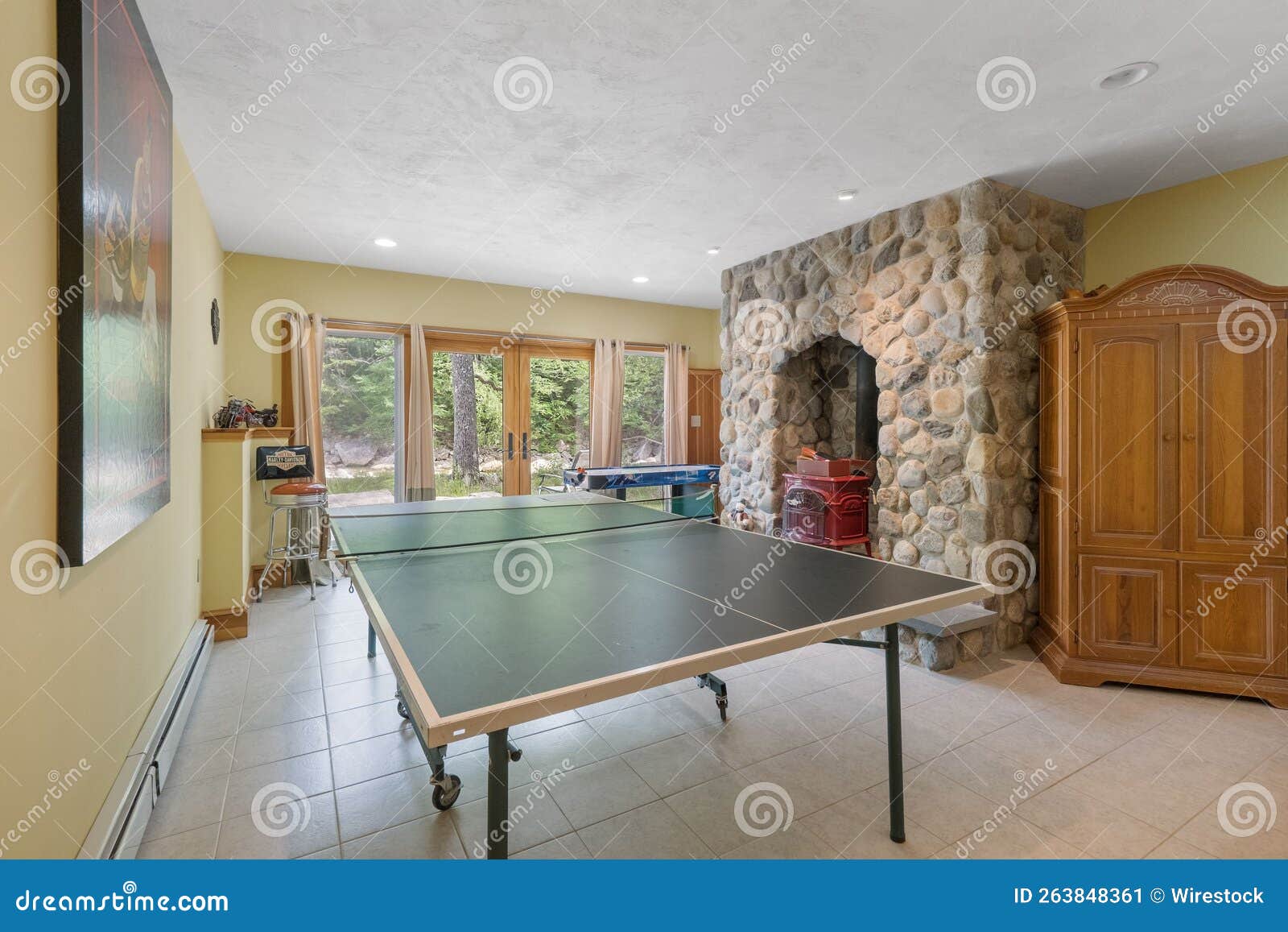 Interior Shot of a Room with a Ping Pong Table, Light Yellow Walls and ...