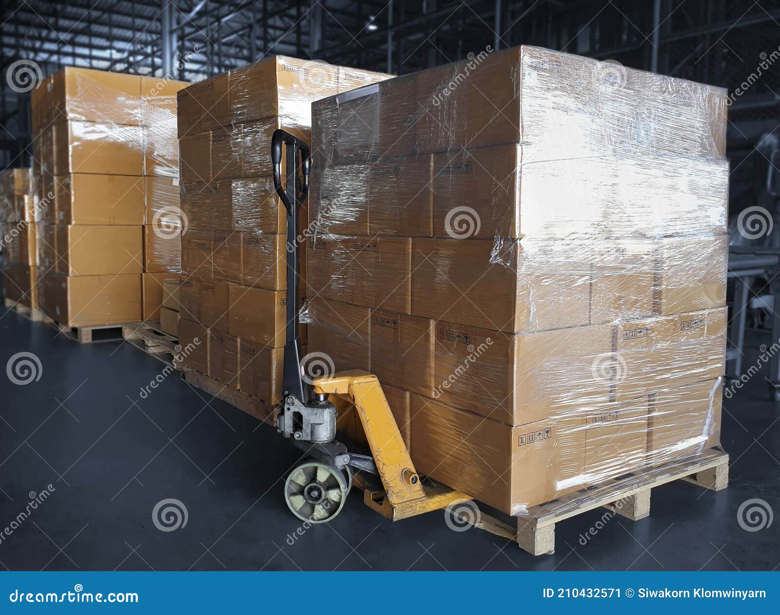 Interior of Storage Warehouse. Stack of Card Board Boxes with Hand ...