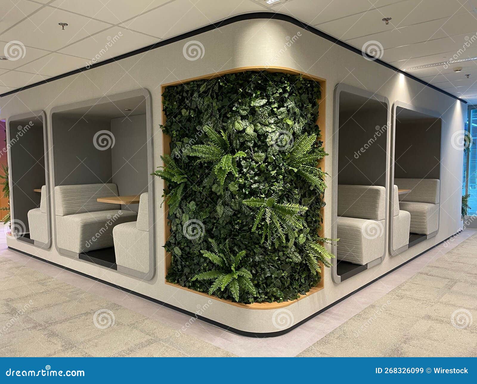 Interior of a Trendy Restaurant with Dining Pods and a Green Wall Stock ...