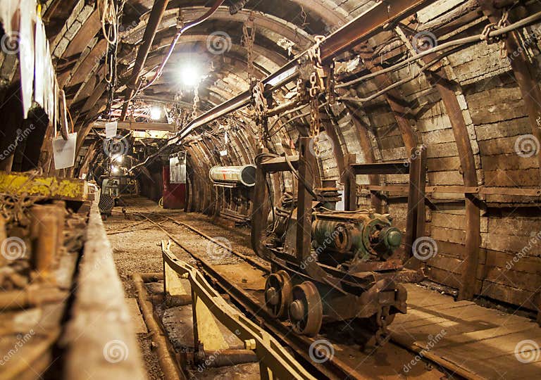 Interior of Underground Mine Passage with Rails, Light and Carriage ...