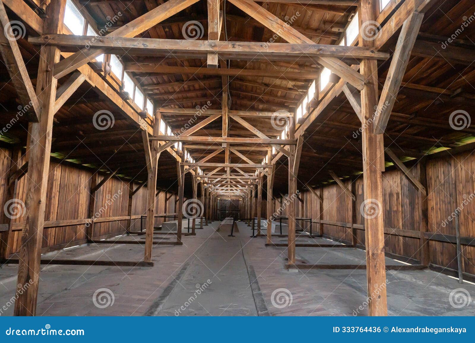 Interior View of an Empty Wooden Barn with Structural Beams and a High ...