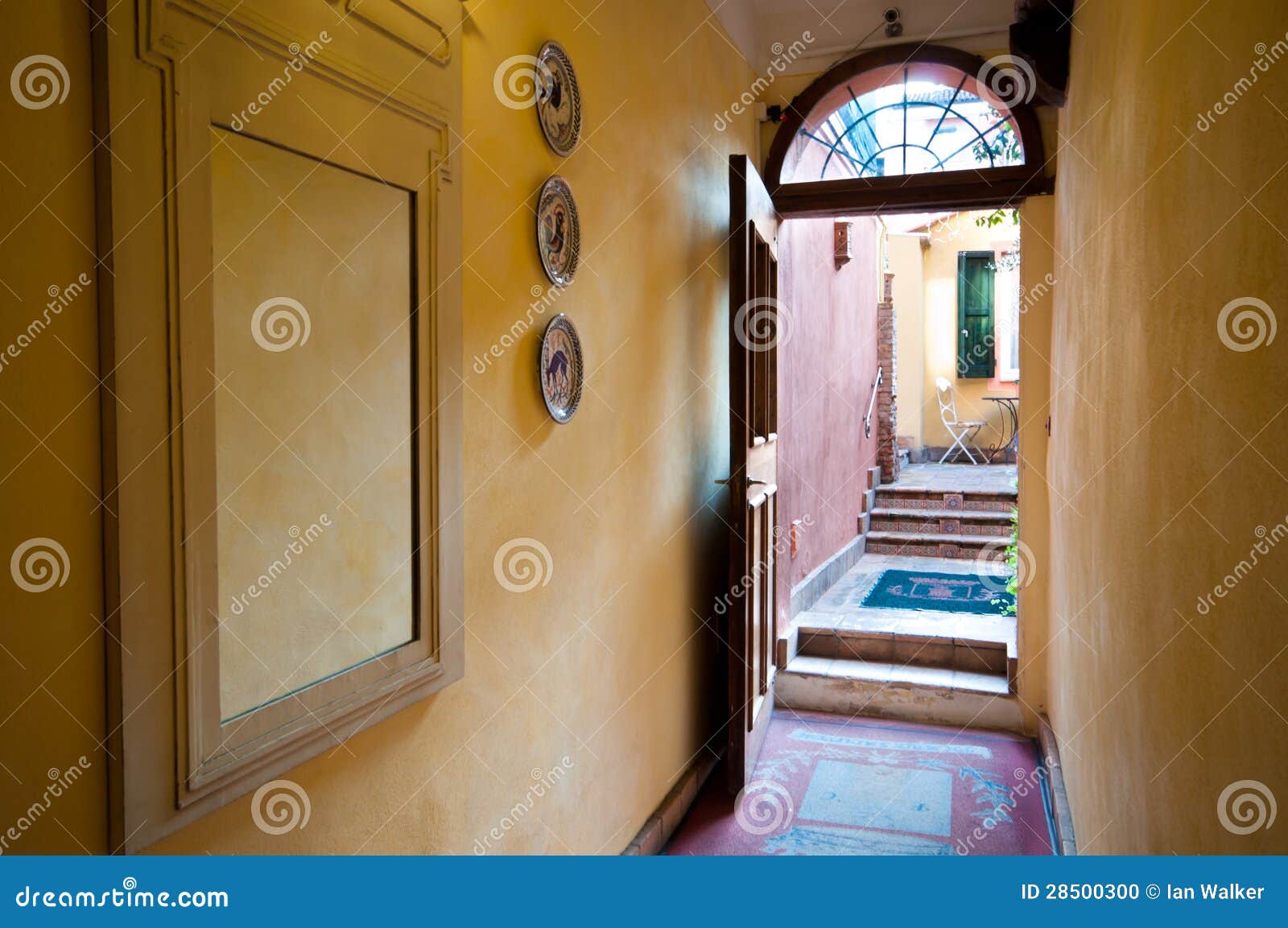 Interior View from Hallway through Open Door To Courtyard of an Stock ...