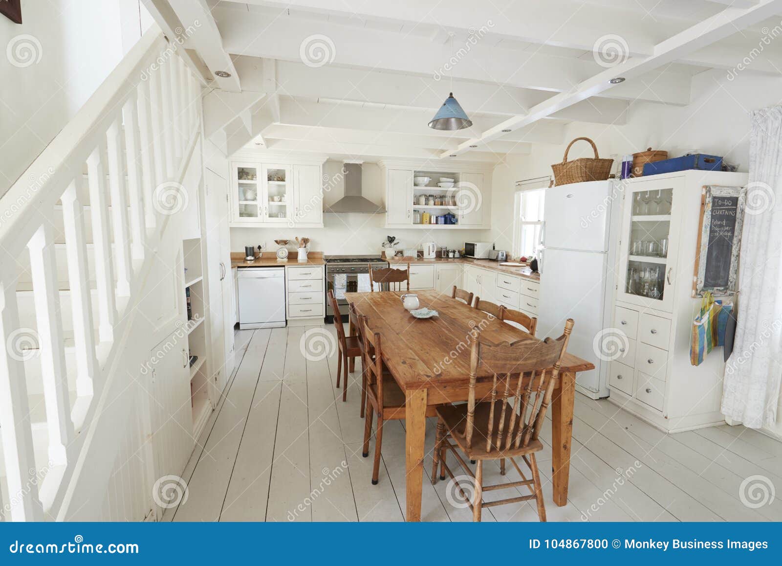 Interior View of Kitchen with Wooden Dining Table Stock Photo - Image ...