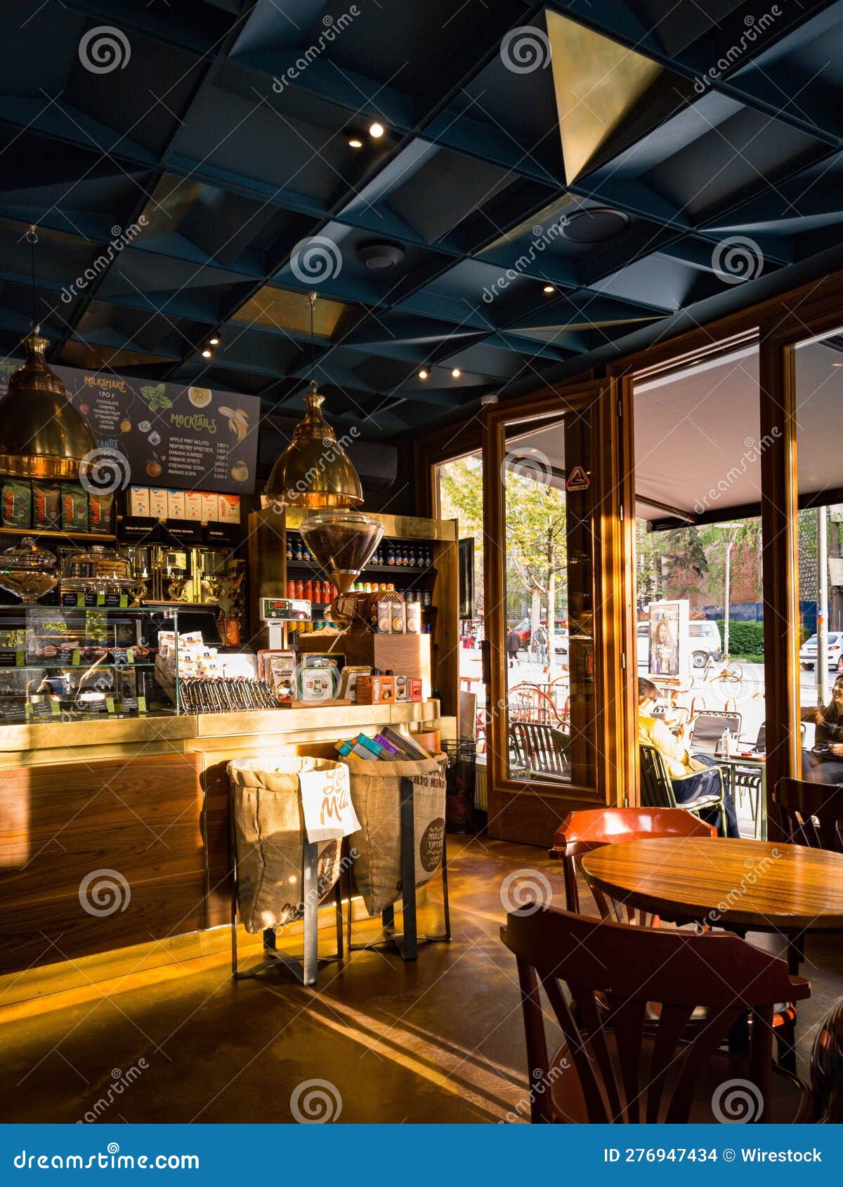 A Restaurant with Tables and Some Chairs Looking in the Window ...