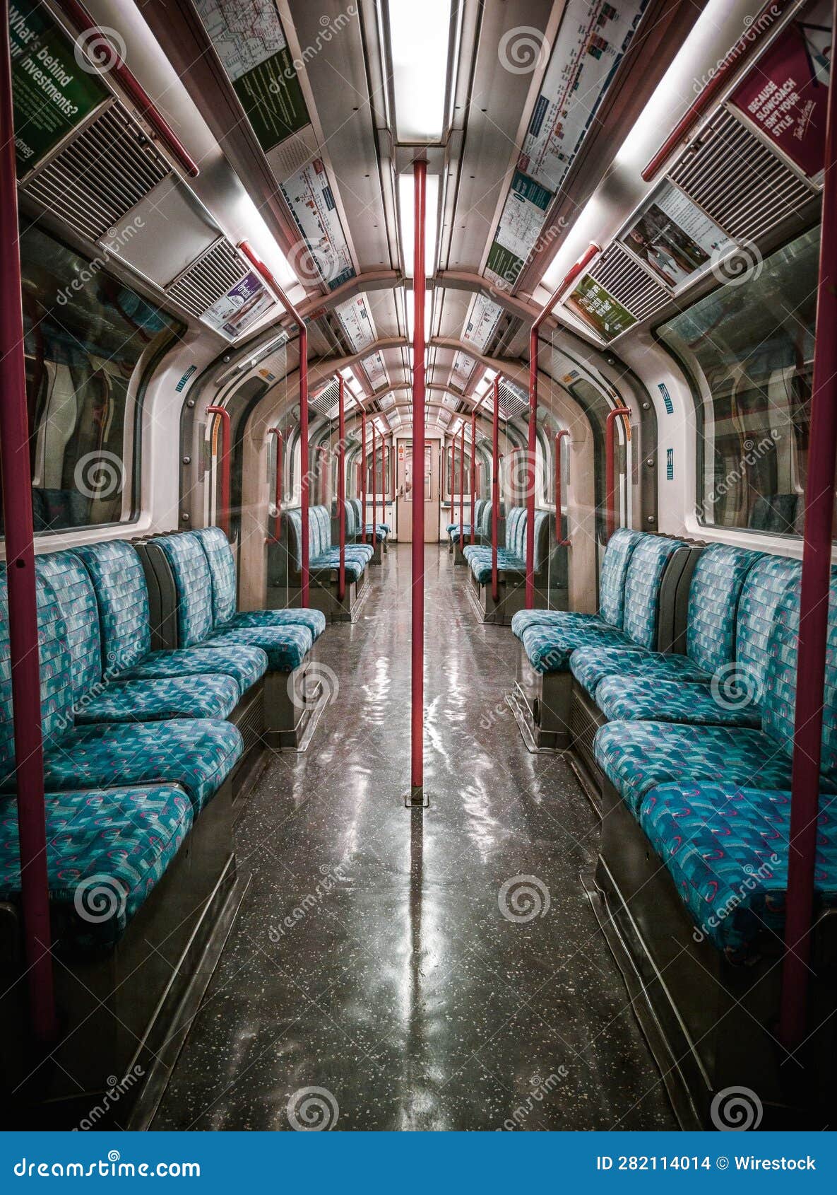 Interior View of a Passenger Train Featuring Blue Seating, Black ...