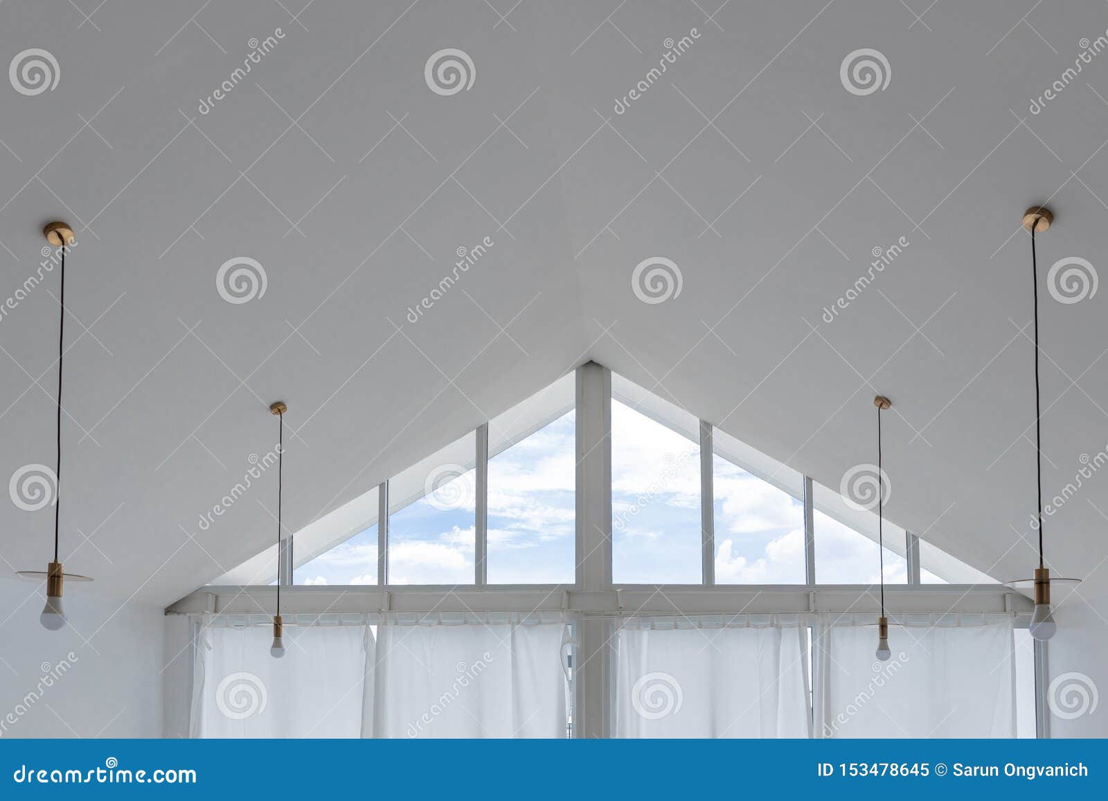 Interior View of Triangle Shape Window with White Curtain and Cloud Sky ...
