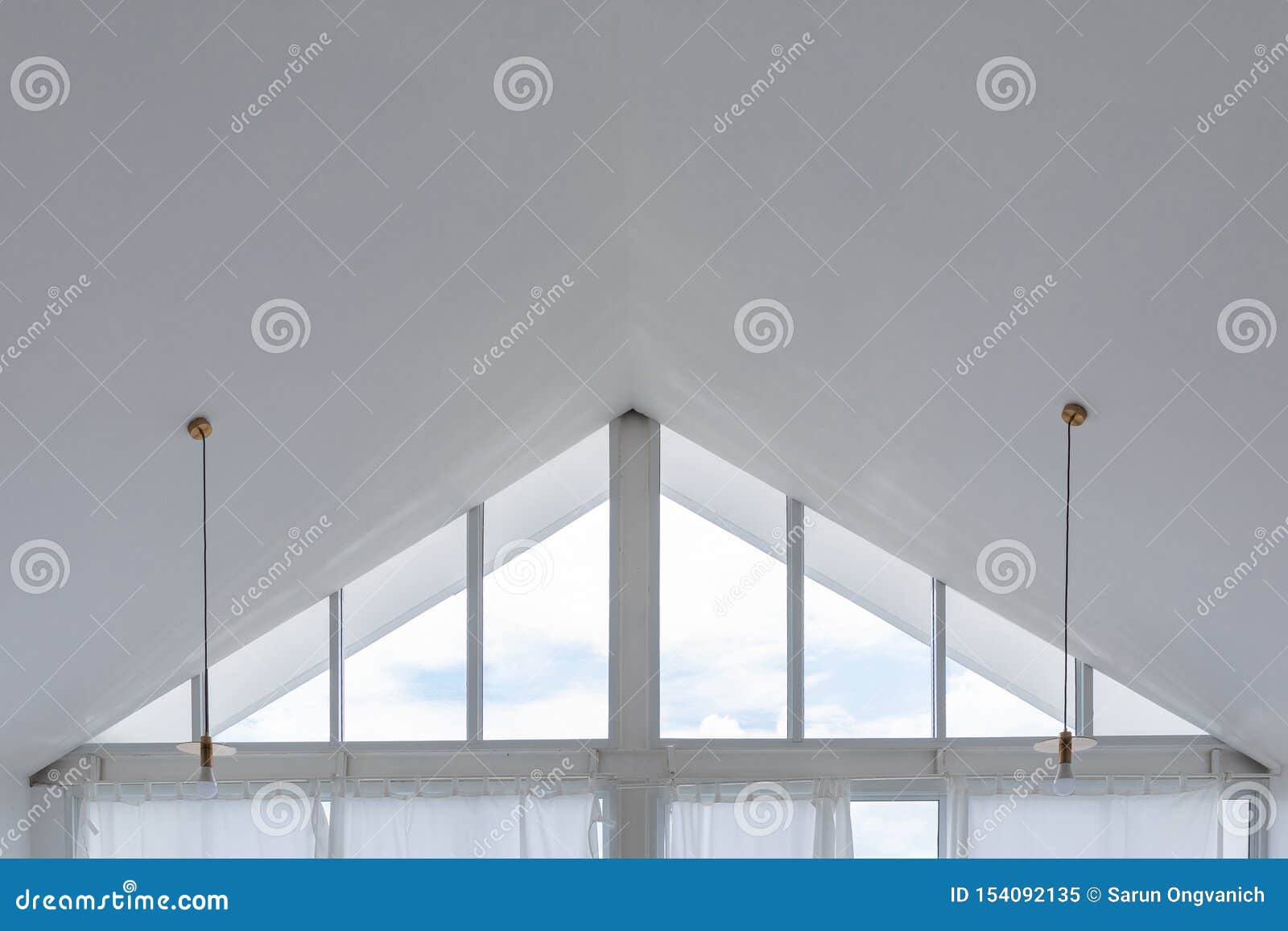 Interior View of Triangle Shape Window with White Curtain and Cloud Sky ...