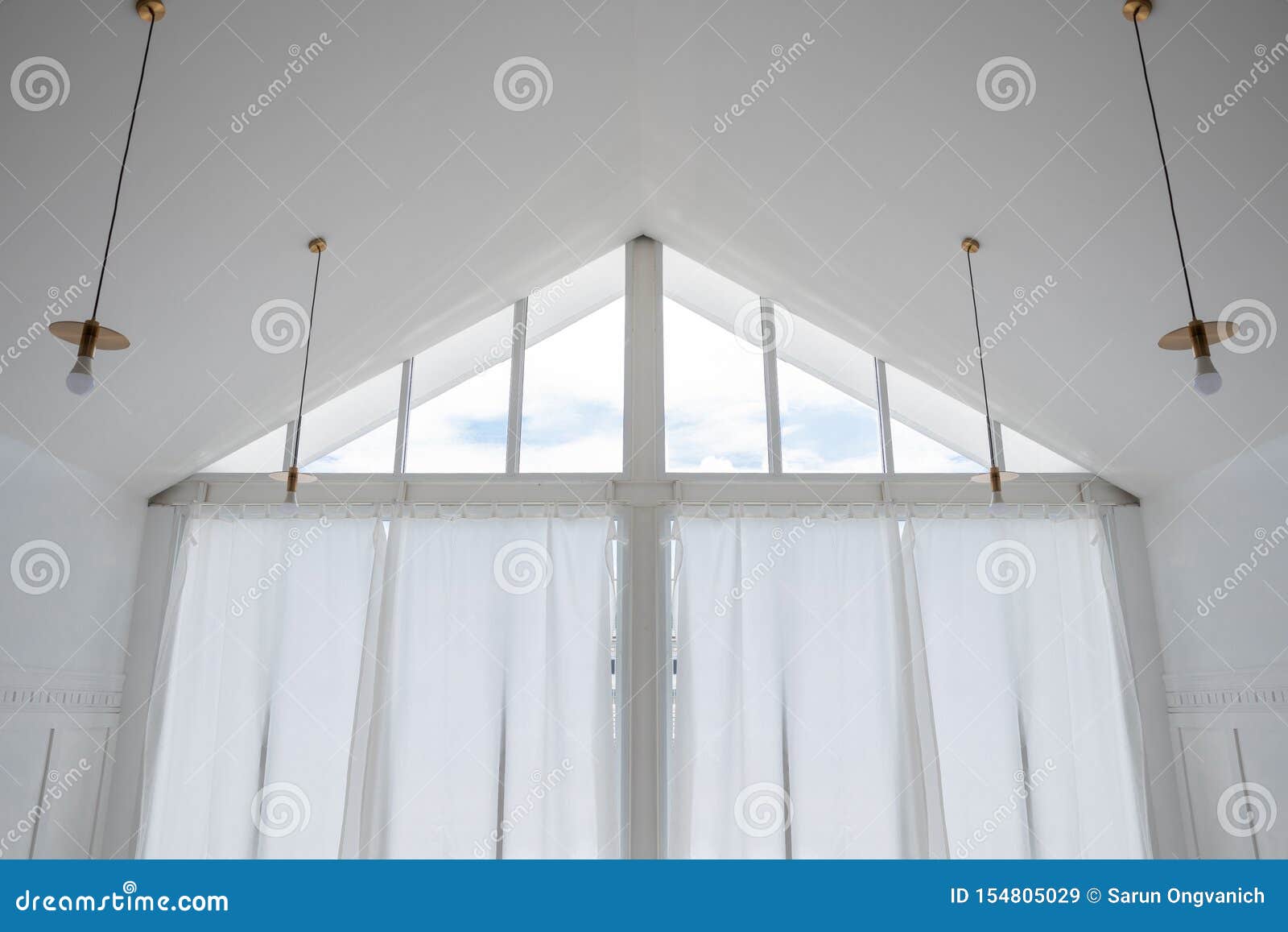 Interior View of Triangle Shape Window with White Curtain and Cloud Sky ...