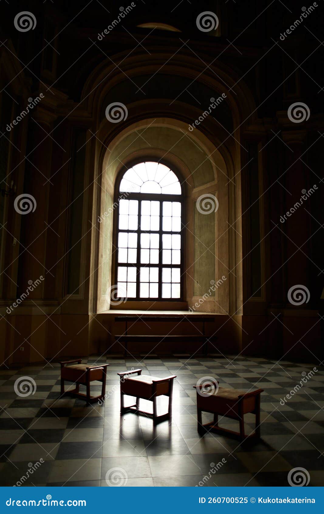 The Interior is a Vintage Hall with a High Ceiling and a Huge Window ...