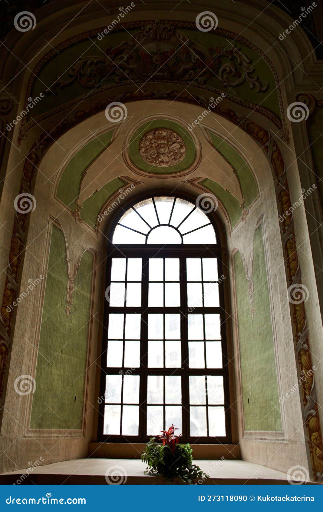 The Interior is a Vintage Hall with a High Ceiling and a Huge Window ...