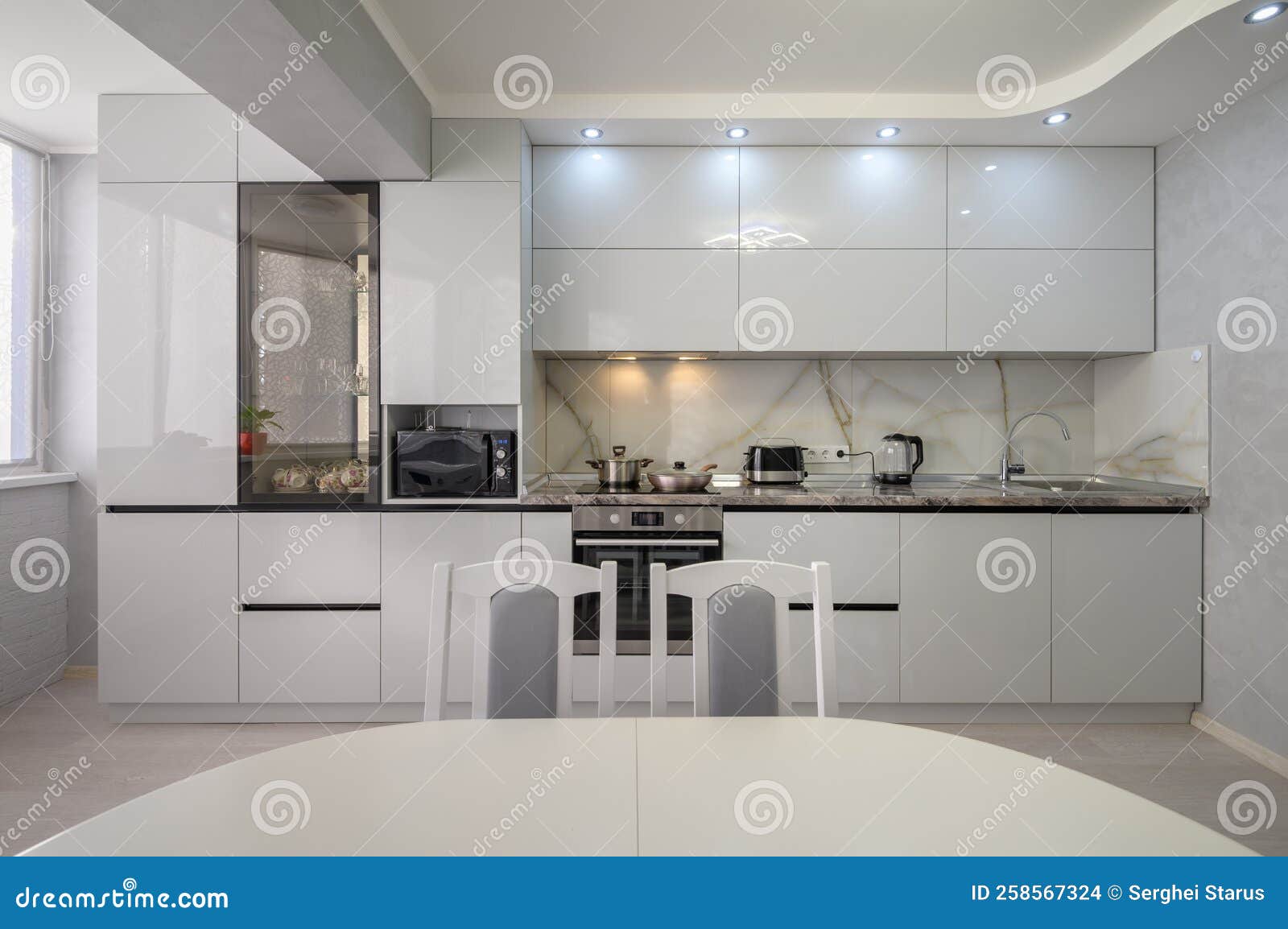 Interior of Modern Trendy White Kitchen, Front View Stock Photo - Image ...