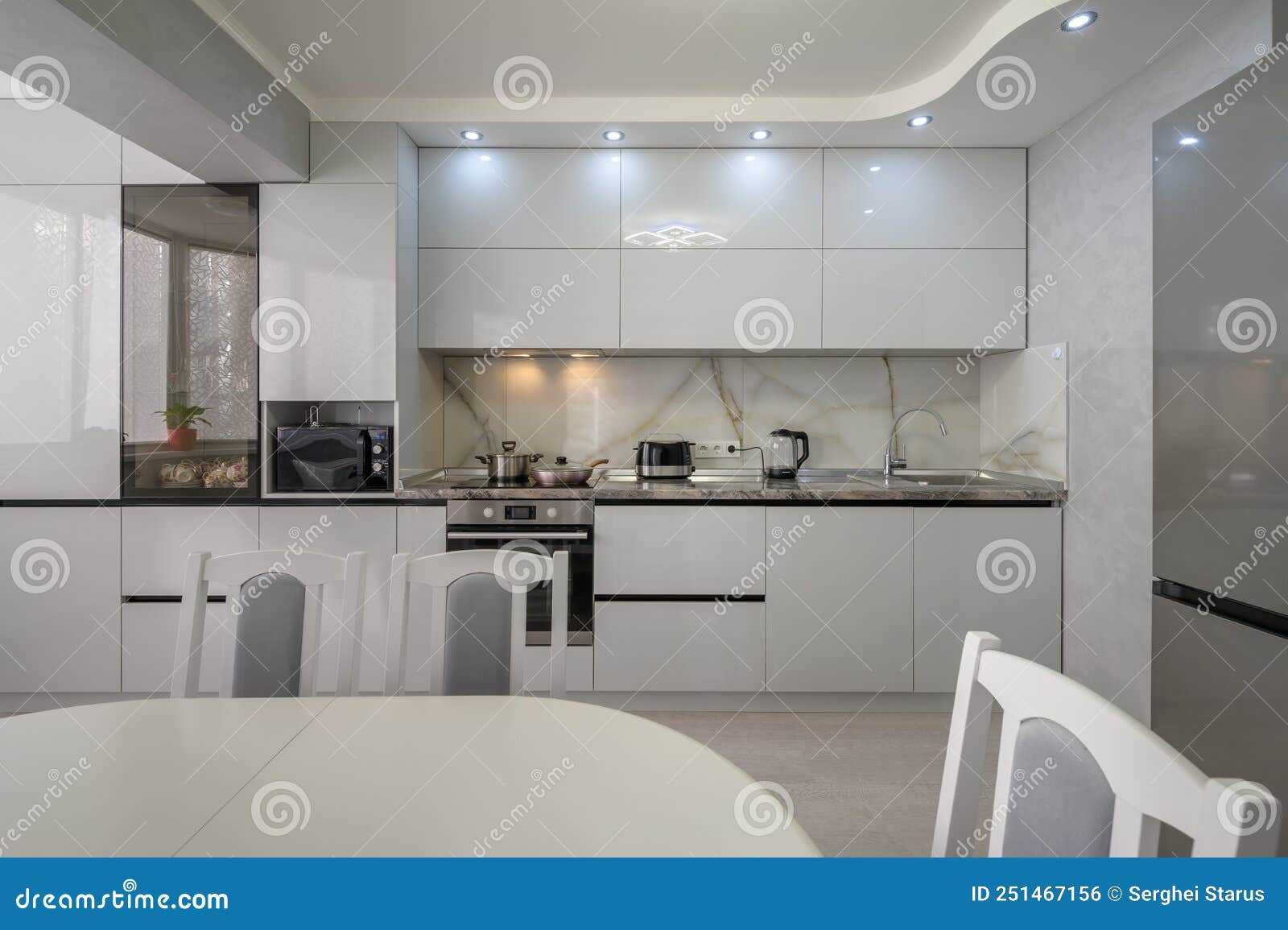 Interior of Modern Trendy White Kitchen, Front View Stock Photo - Image ...