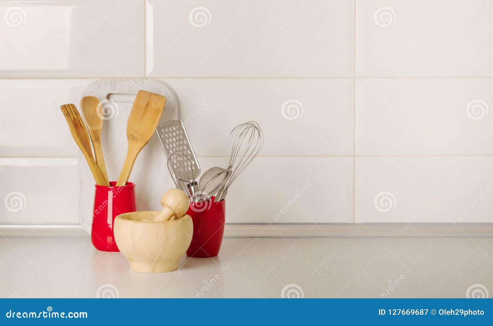 Interior White Kitchen with Kitchen Tools and Red Crockery. Stock Image ...