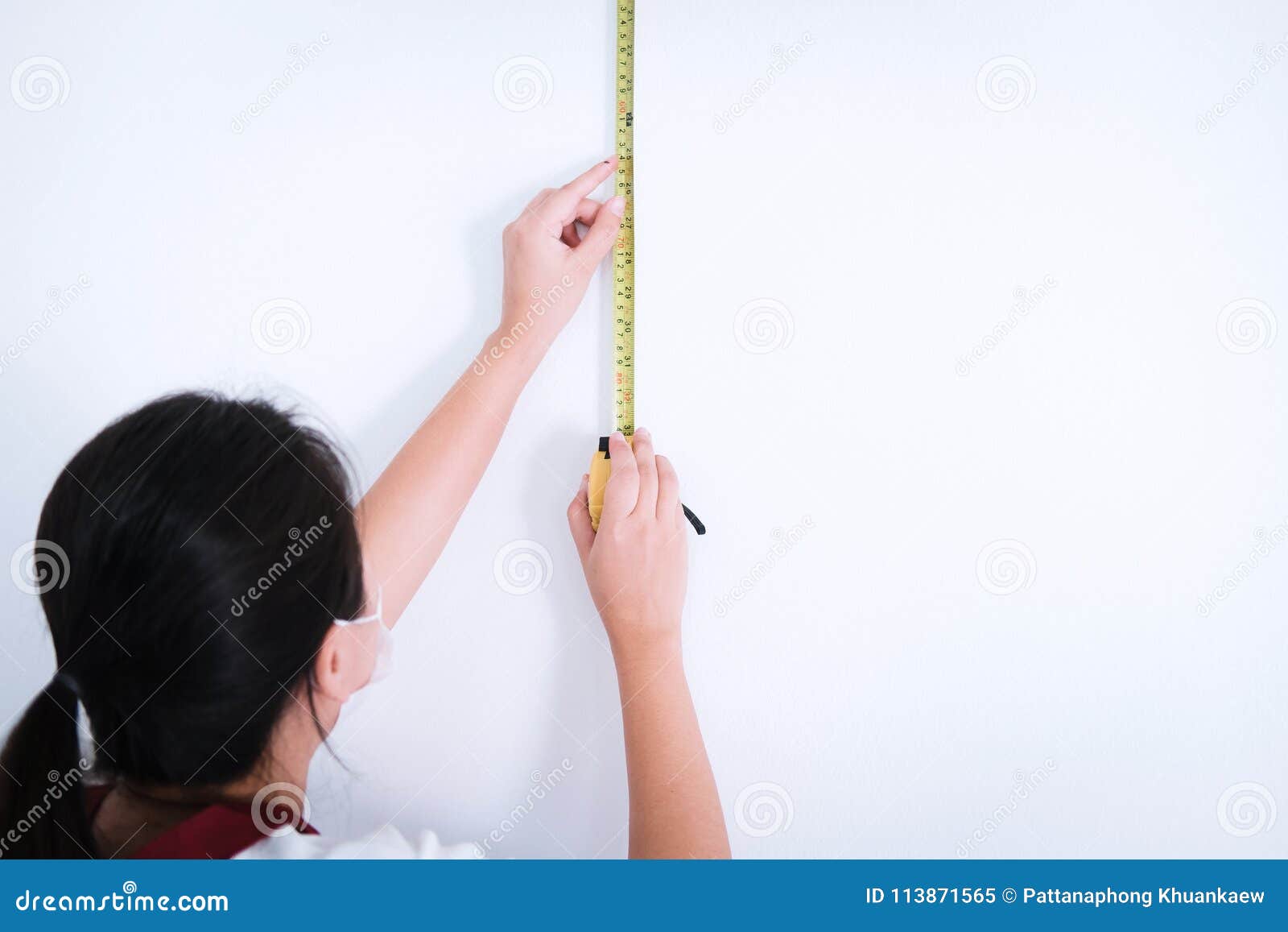 Interior Working, Female Painter with Measure Tape Checking Wall Stock ...