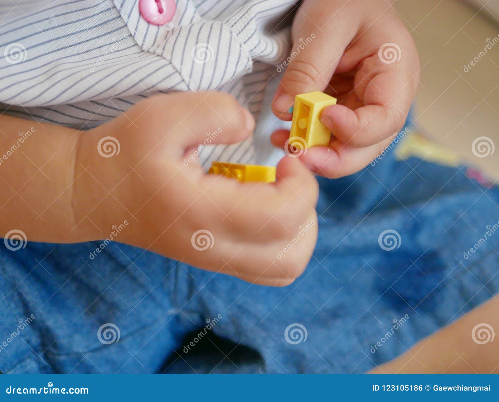 Interlocking Plastic Bricks Toy in Baby`s Hands Stock Photo - Image of ...