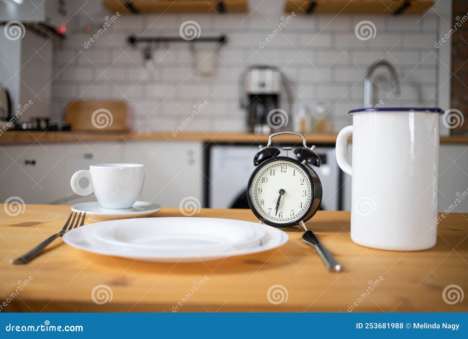 Intermittent Fasting Concept Alarm Clock on Kitchen Table Stock Photo ...