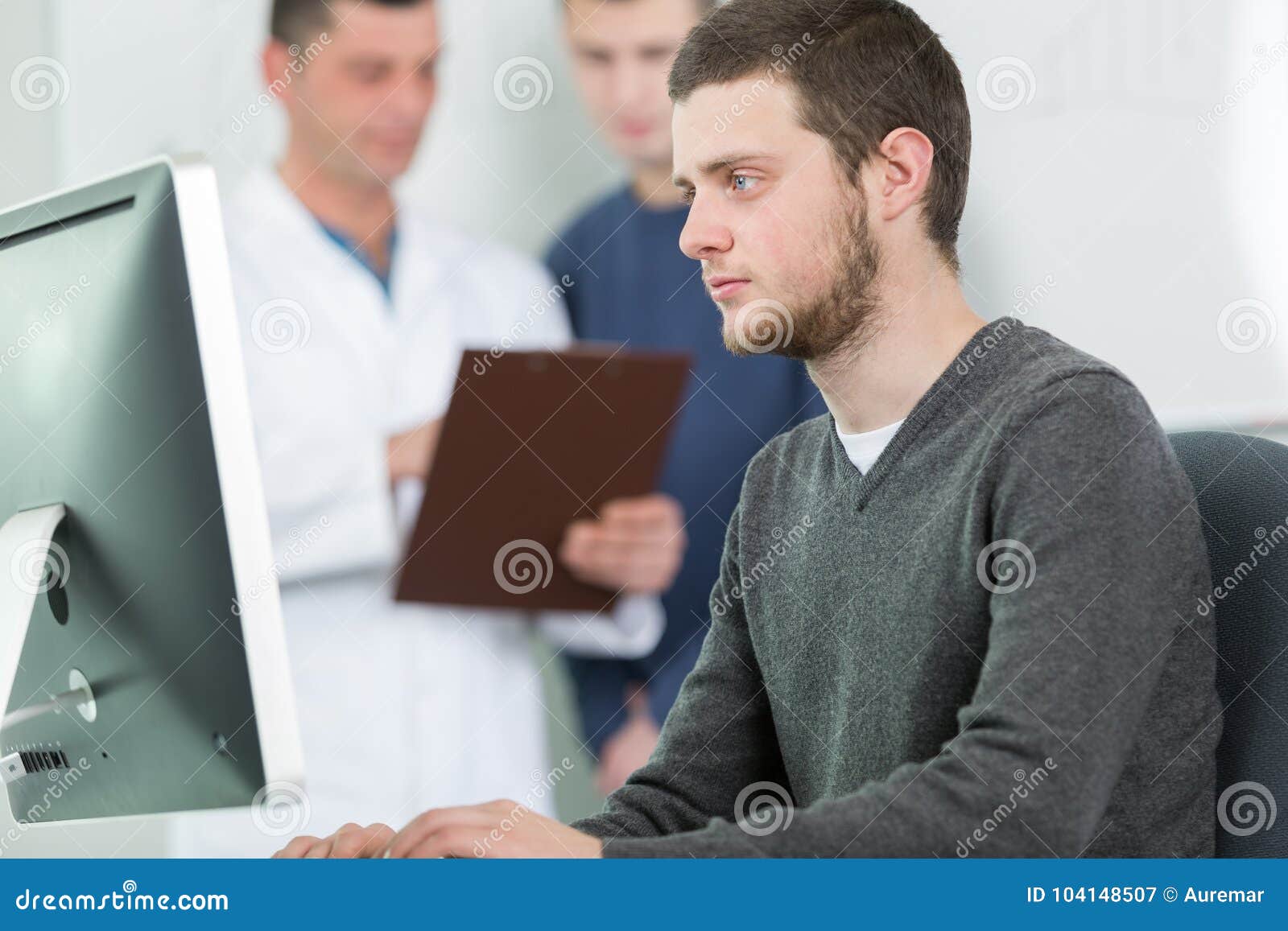 Intern typing on computer stock image. Image of clinic - 104148507