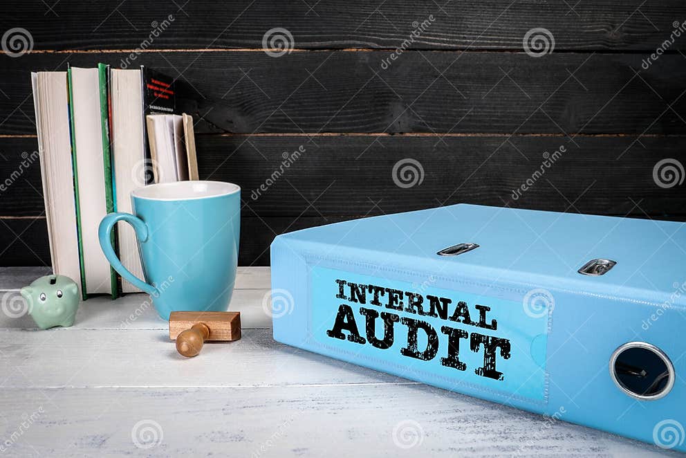 Internal Audit. Blue Office Document Binder on a Wooden Table Stock ...