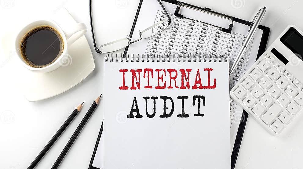 INTERNAL AUDIT Text on the Paper with Calculator, Notepad, Coffee ,pen ...