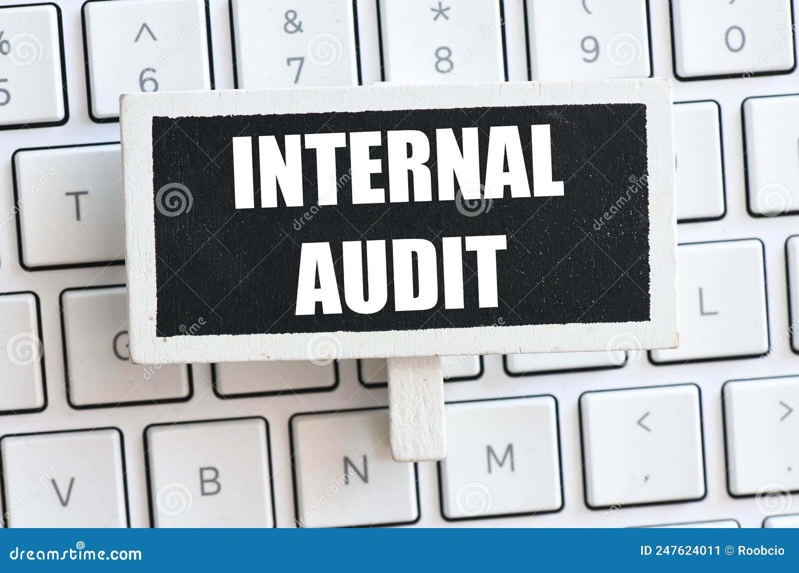 INTERNAL AUDIT Words on a Small Chalkboard Located on a Computer ...