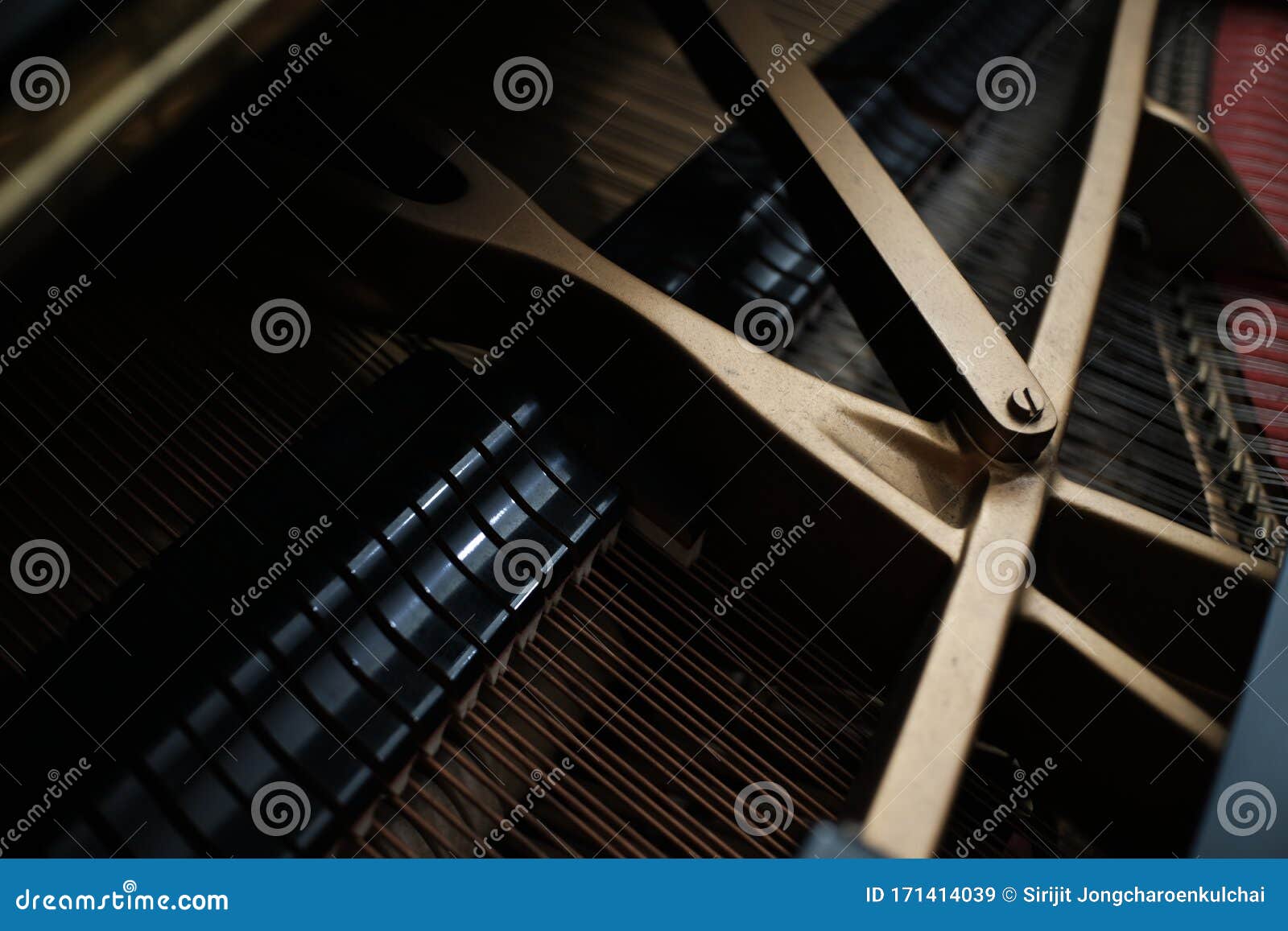 Internal Parts of an Upright Piano Strings and a Tuning Key on the Pins ...
