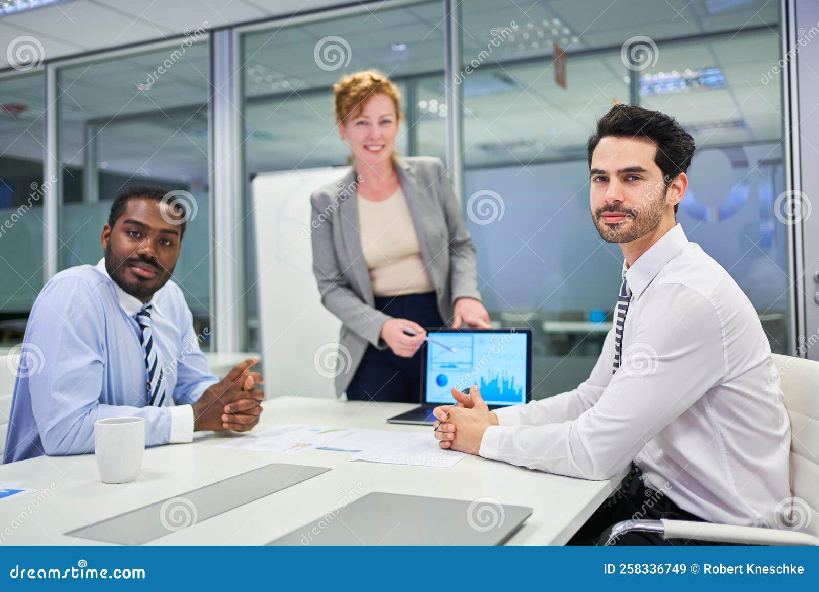 International Business Team Using Laptop in a Meeting Stock Image ...